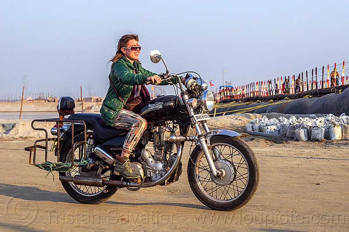 woman riding royal enfield bullet thunderbird motorcycle