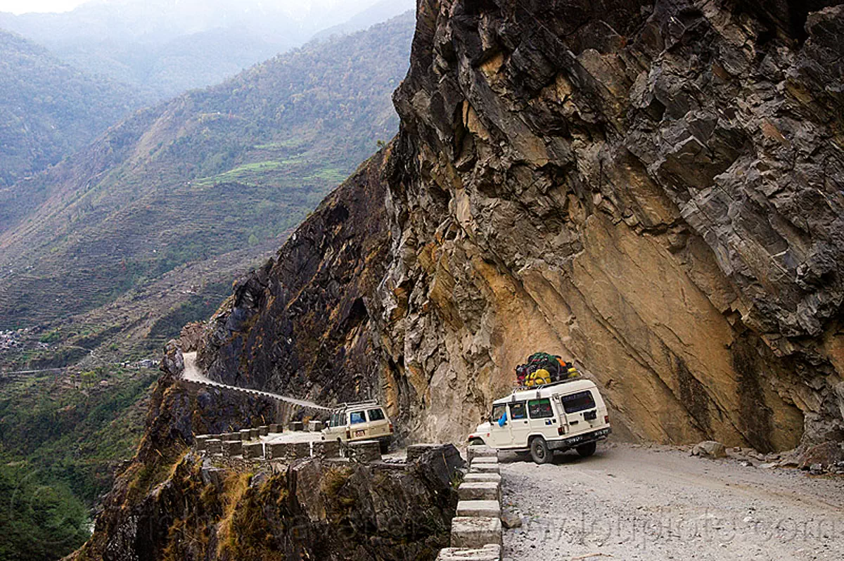 jeeps on mountain dirt road, kali gandaki valley, annapurnas, nepal