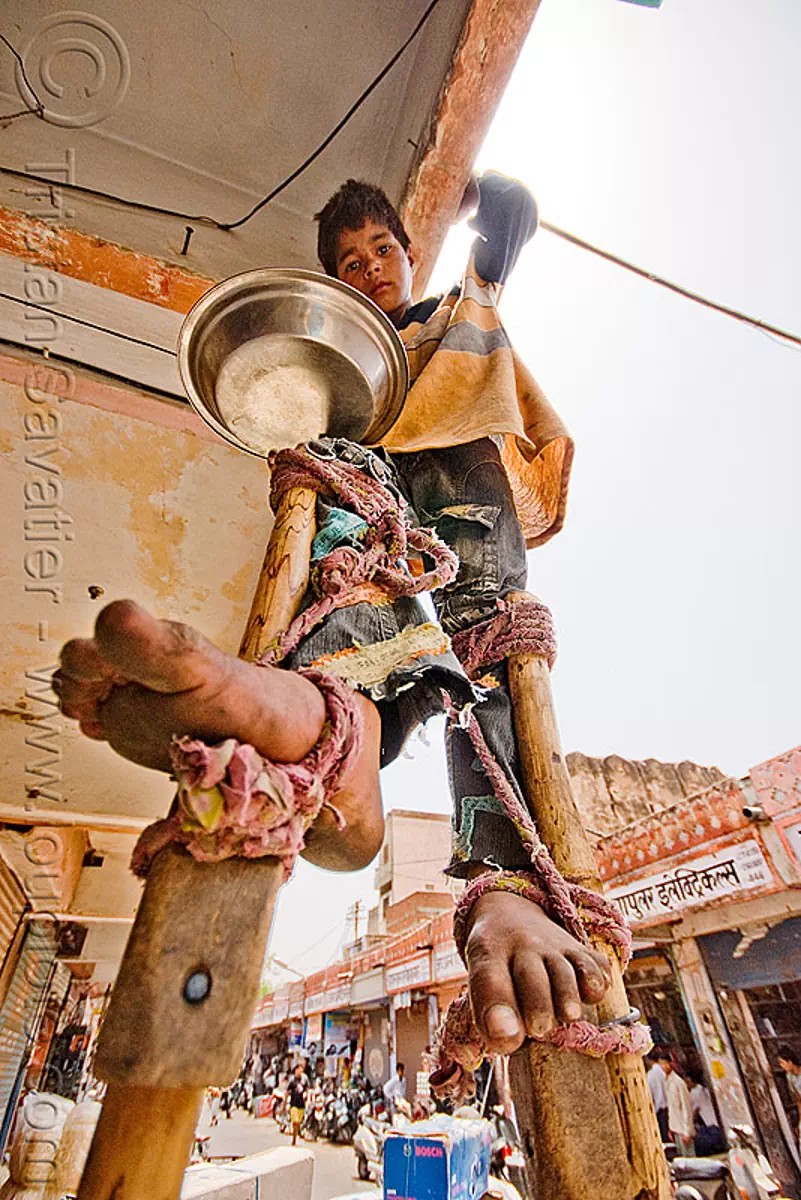 boy begging on stilts, jaipur, india