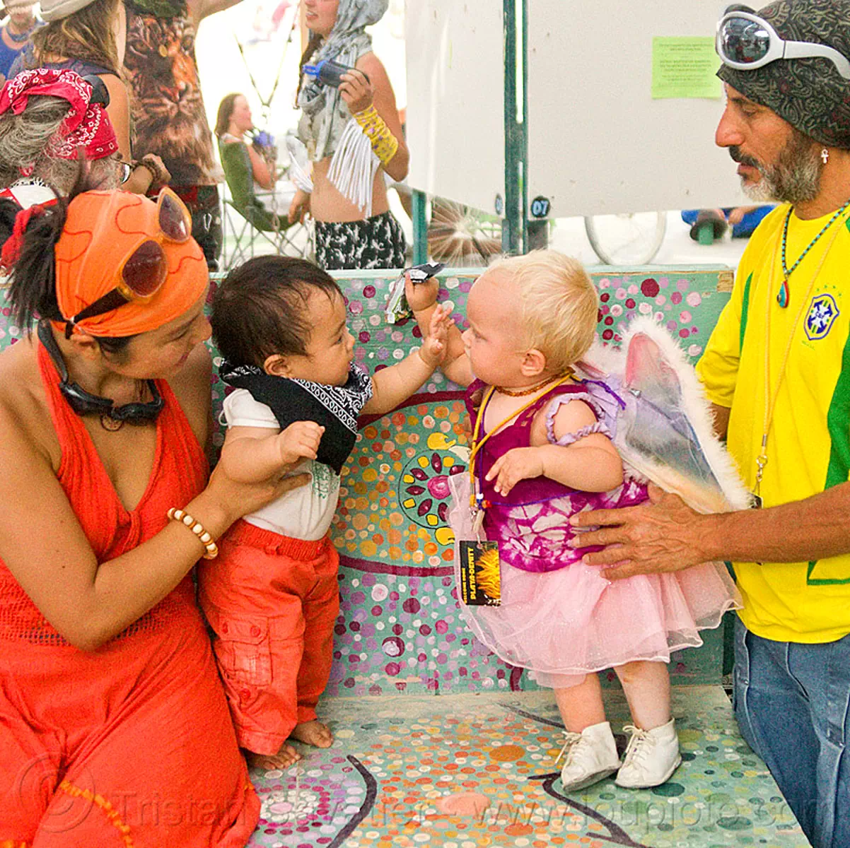 burning man, babies playing