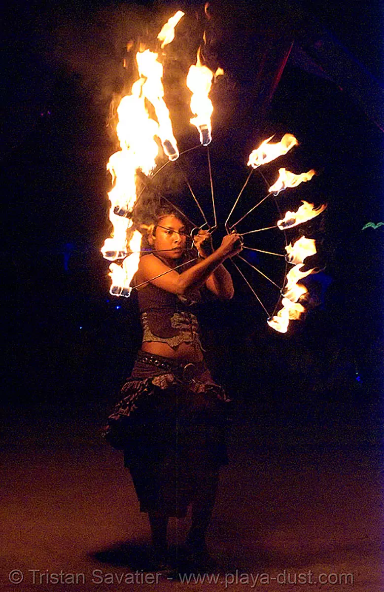burning man, dancer with fire fans