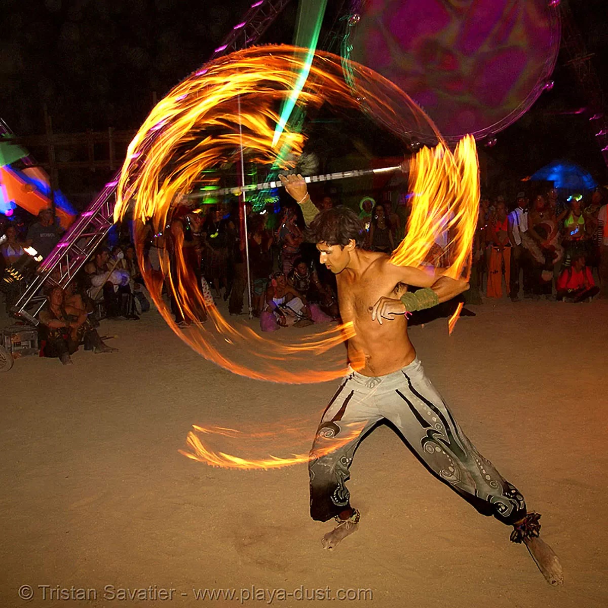 burning man, keith aka srikanta spinning a fire staff