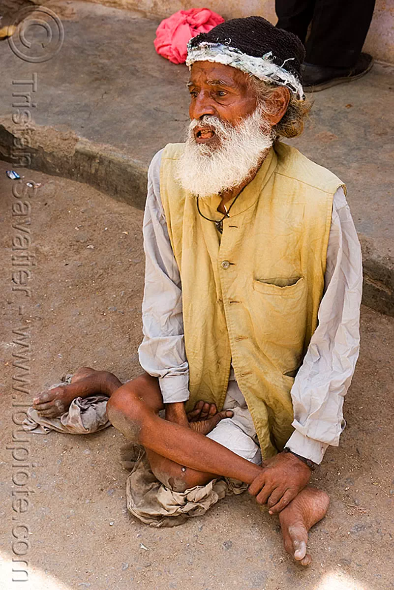 crippled street beggar, india