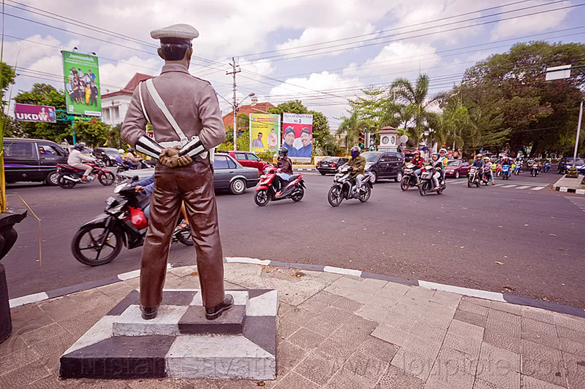 fake cop statue watching traffic, yogyakarta