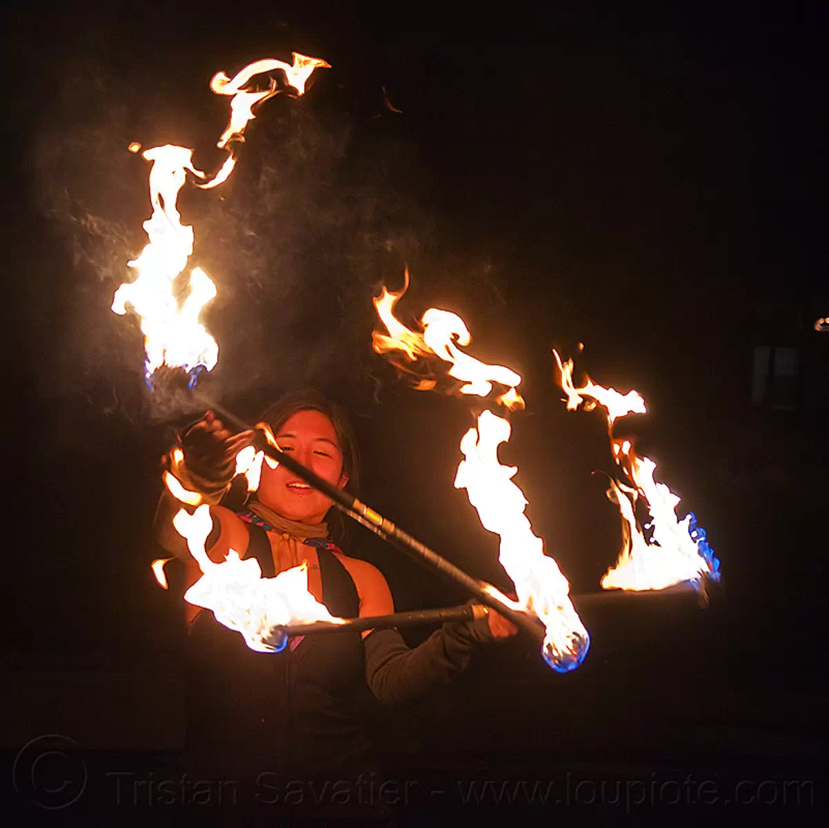 fire dancer "mel" with double fire staffs