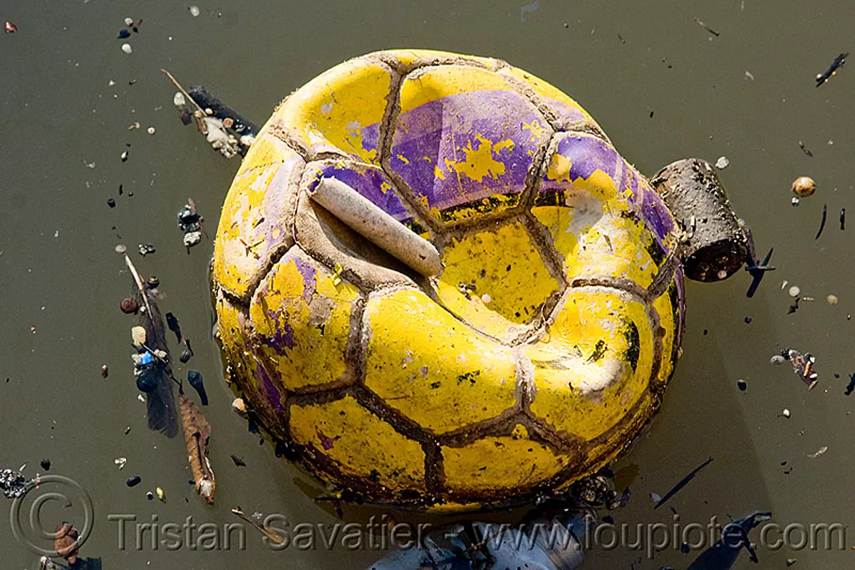 foating trash, football, soccer ball | Stock Photo #4455915303