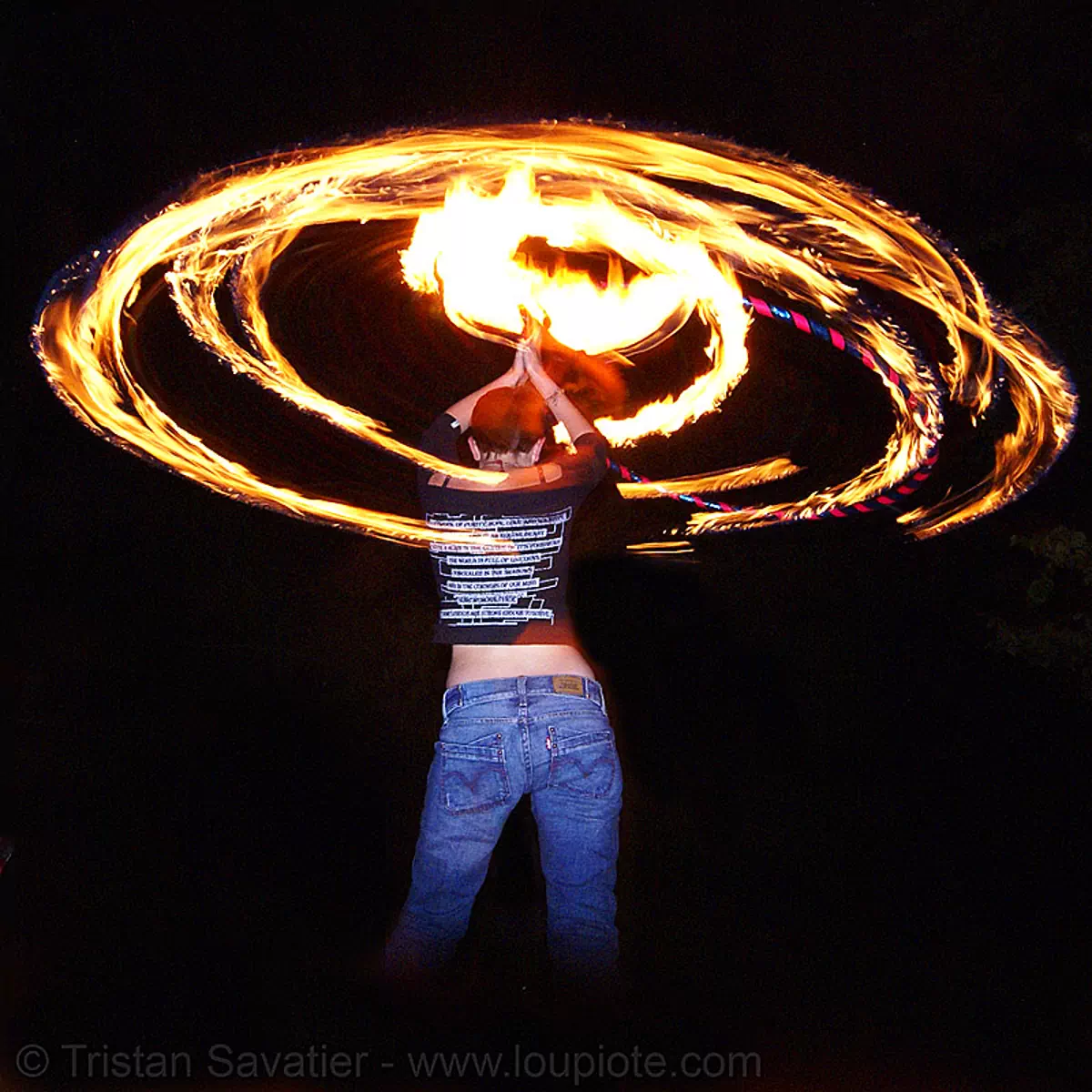 gina spinning a fire hula hoop, san francisco