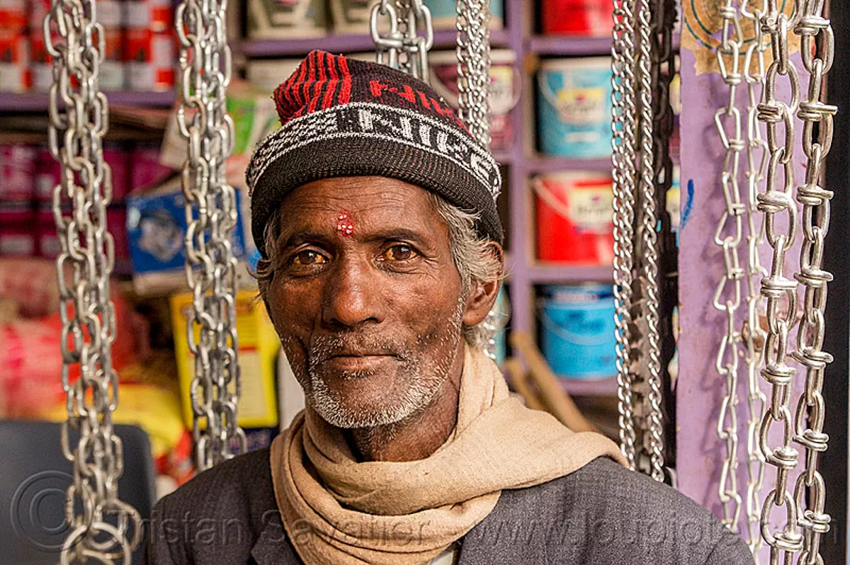 hindu chain merchant in his chains store, india