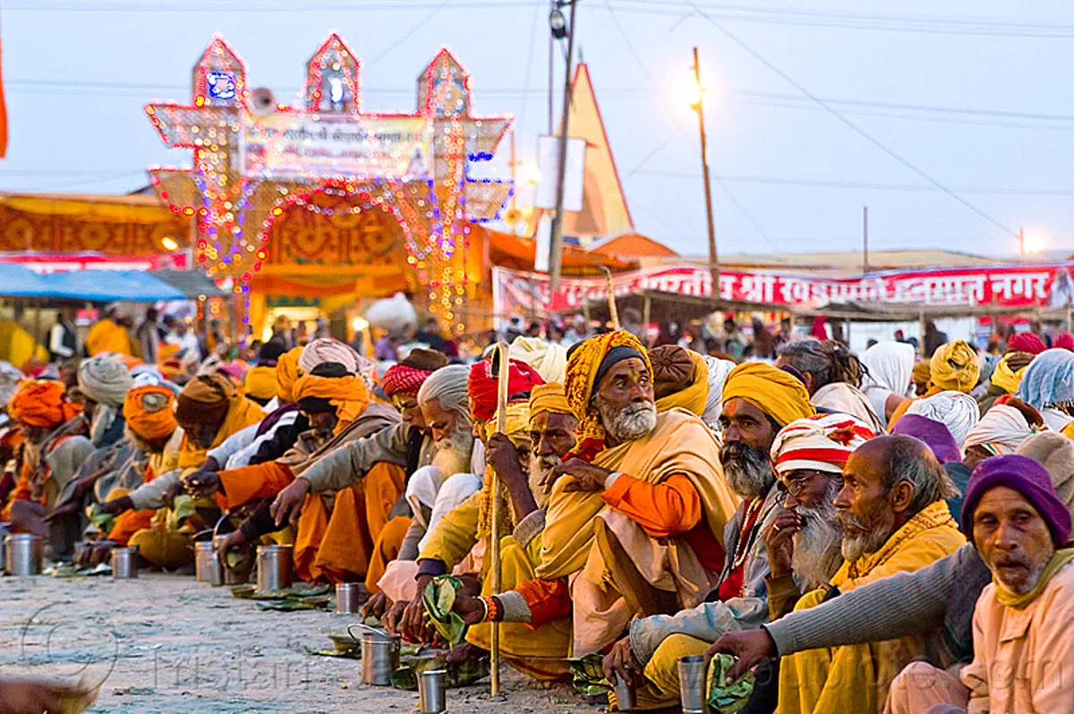 hindu pilgrims eating holy prasad, kumbh mela 2013, india