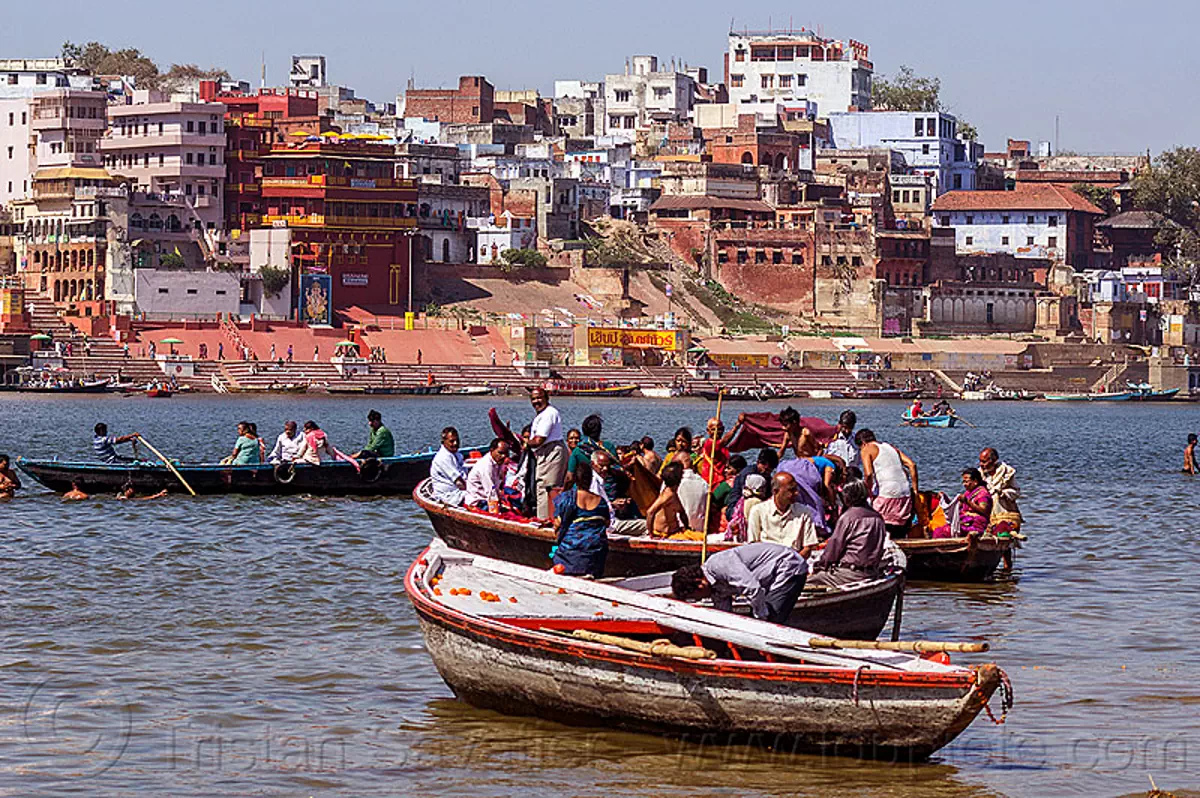 hindu pilgrims on boats, ghats of varanasi, india