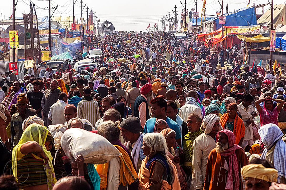 hindu pilgrims on crowded street, india