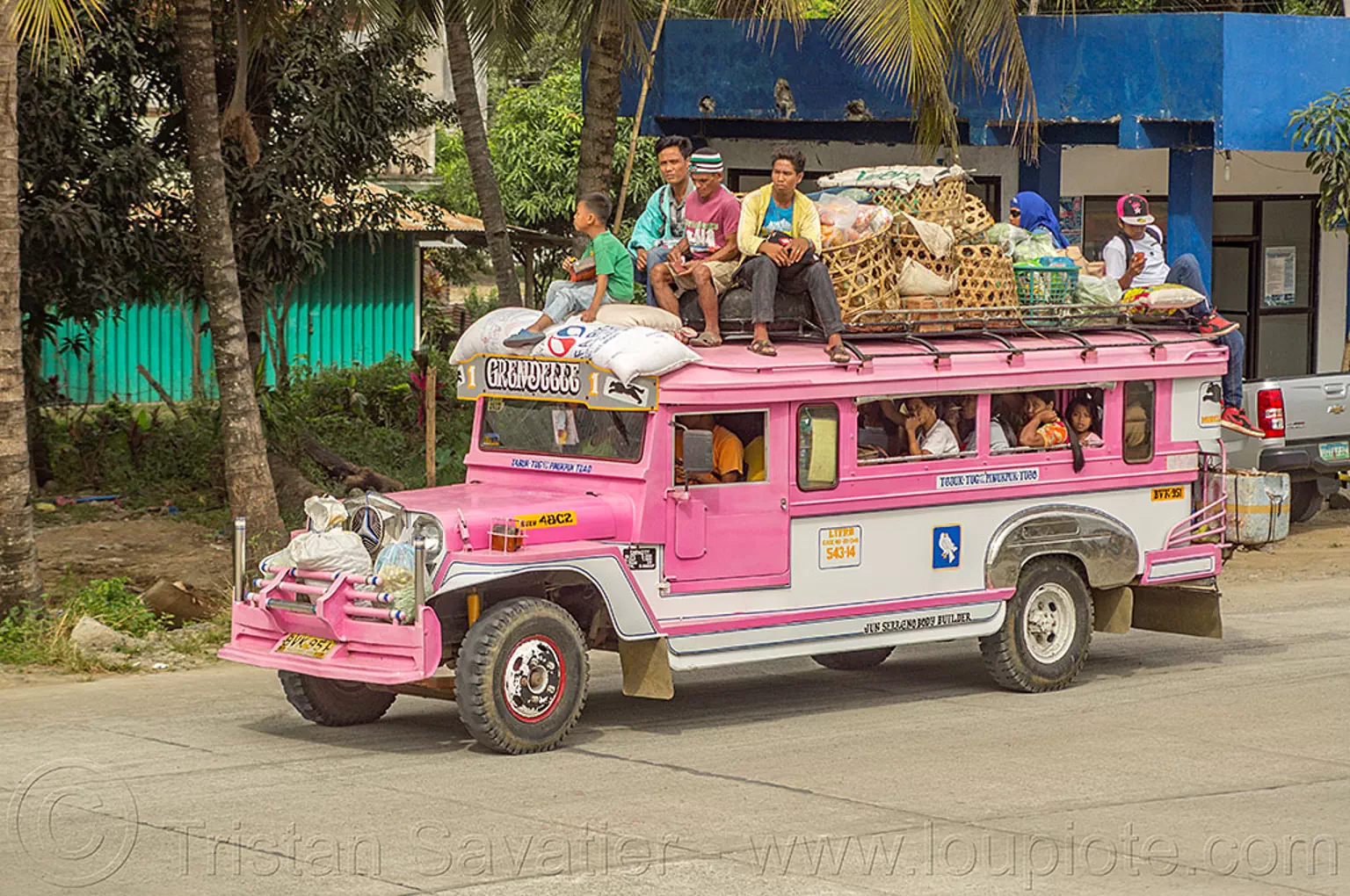 jeepney with passengers on roof, philippines