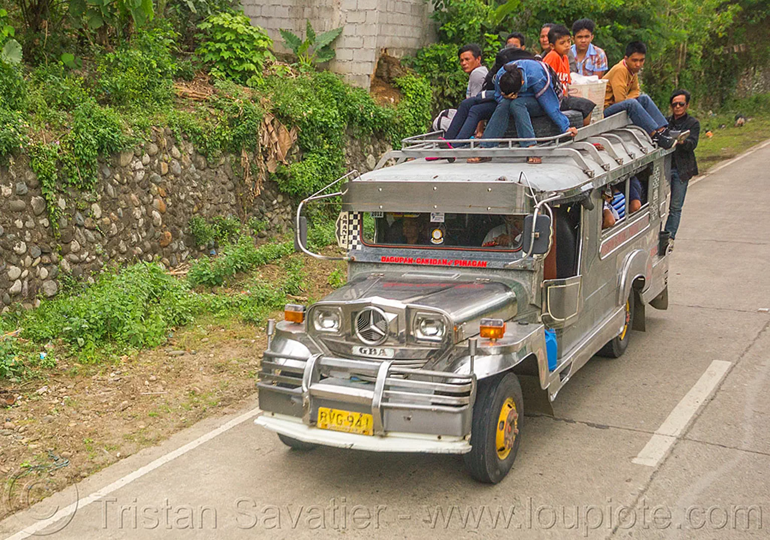 jeepney with passengers on roof, philippines