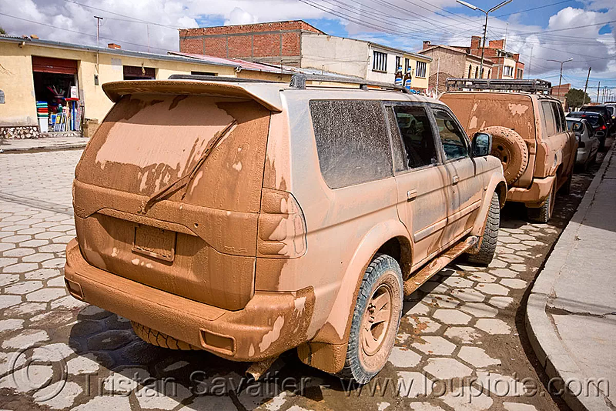 muddy 4x4 SUVs returning from an expedition, uyuni, bolivia