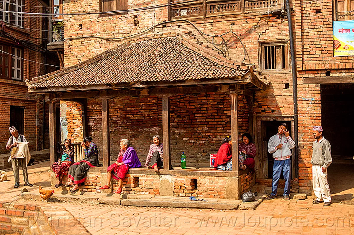 nepali people sitting in a pati, nepal