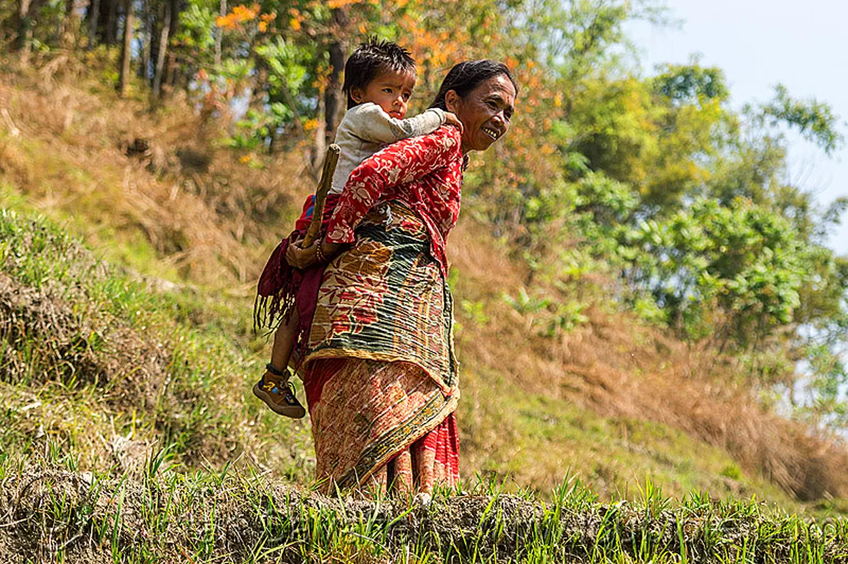 nepali woman carrying little boy on her back, nepal, child, kid ...