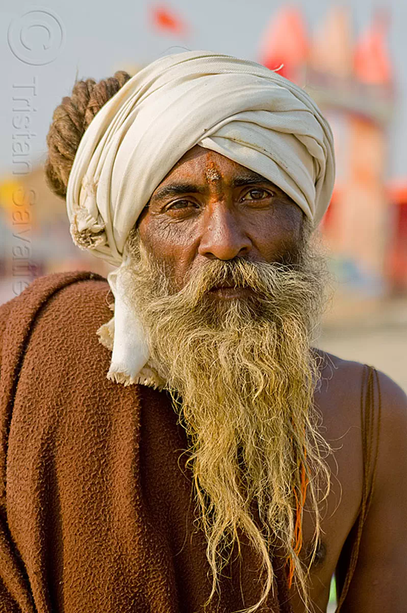 old hindu pilgrim with long beard at kumbh mela 2013