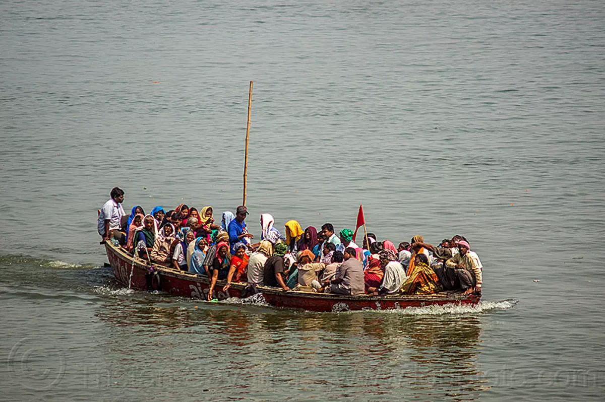overcrowded boat on the ganges river, hindu pilgrims, varanasi