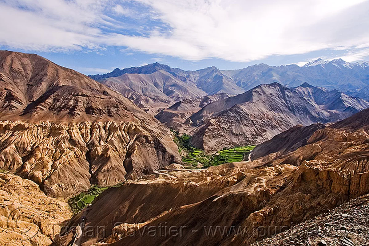 rugged landscape and green valley near lamayuru, leh to srinagar road ...