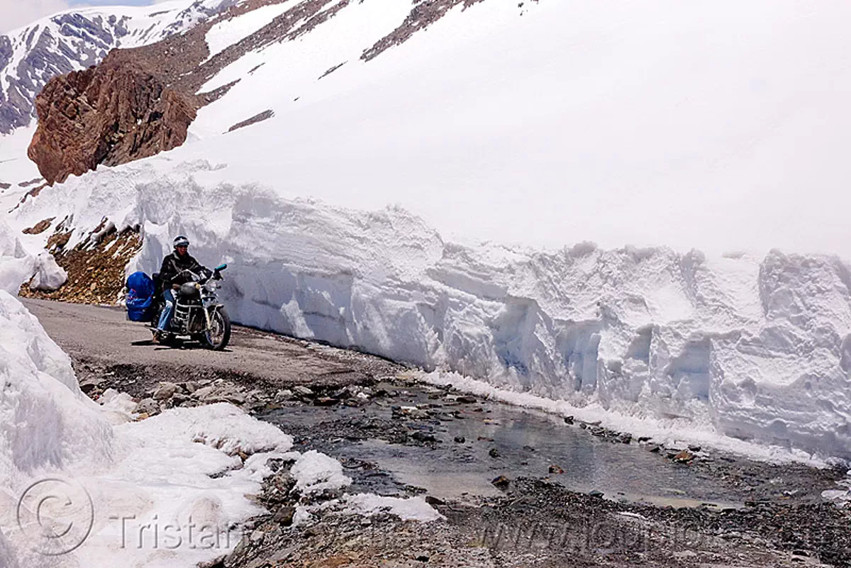 snow walls and nullah near baralacha pass, manali to leh road, india