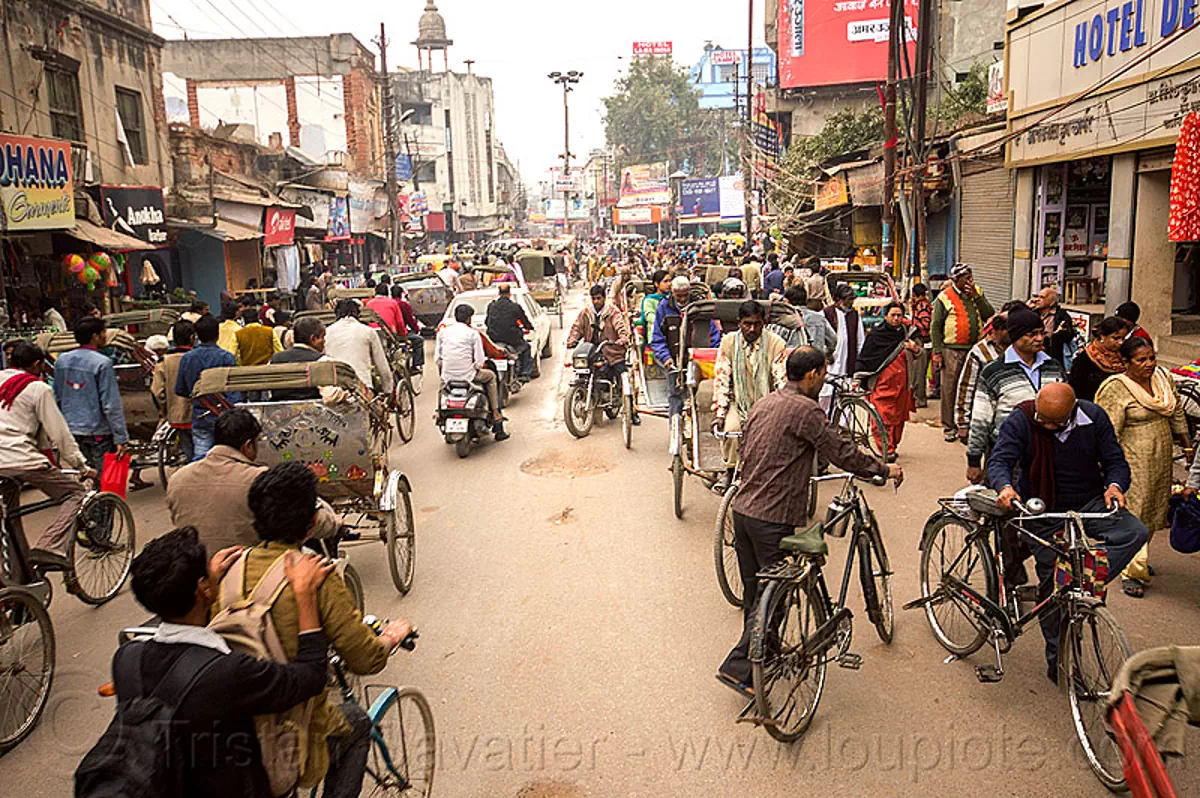 street traffic, cycle rickshaws, bicycles and motorbikes, india