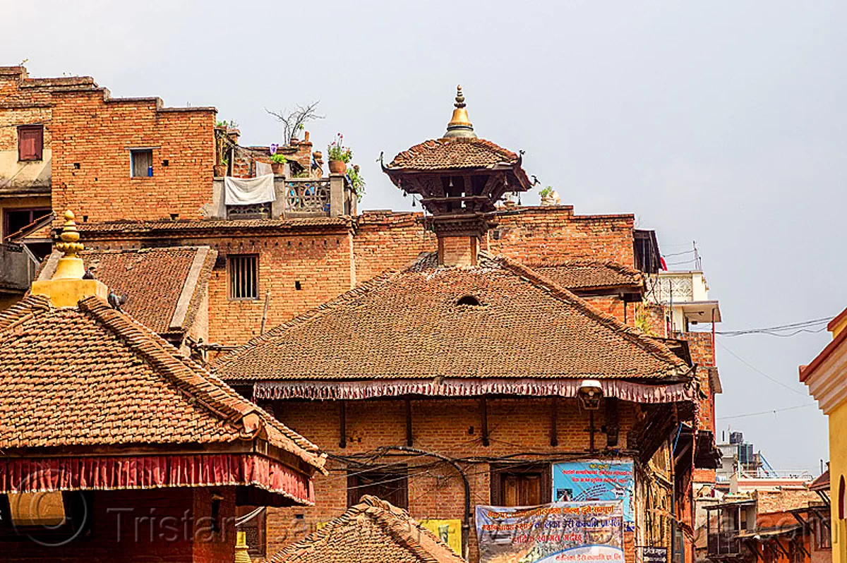 traditional nepali roofs with central brick chimney, nepal