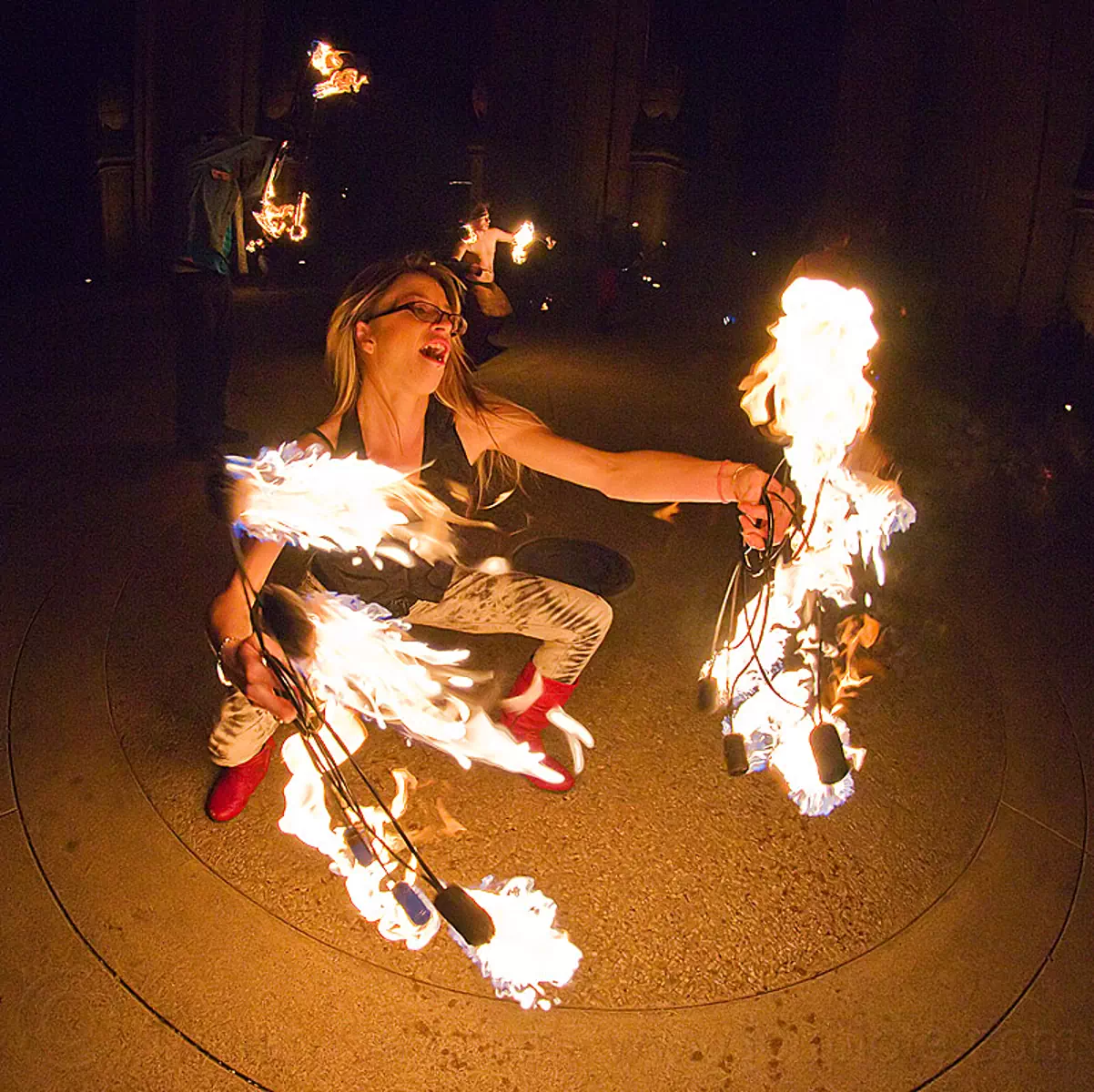 woman dancing with fire fans, cressie mae