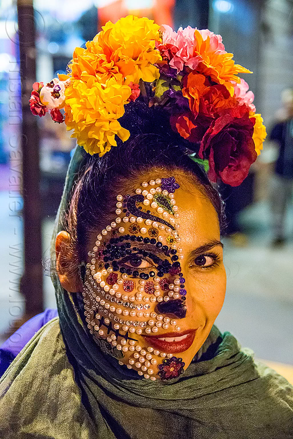 woman with sugar skull makeup made of many pearls glued to her face ...