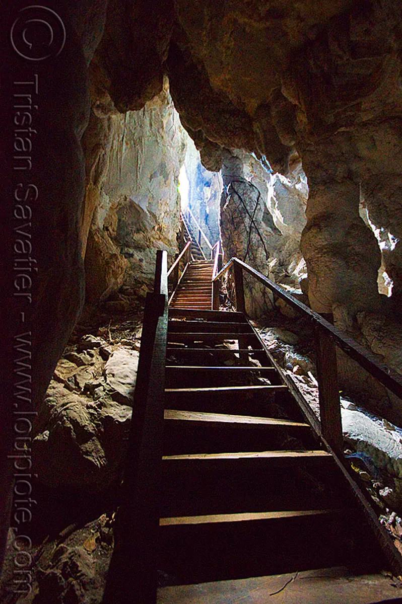 wooden stairs in natural cave