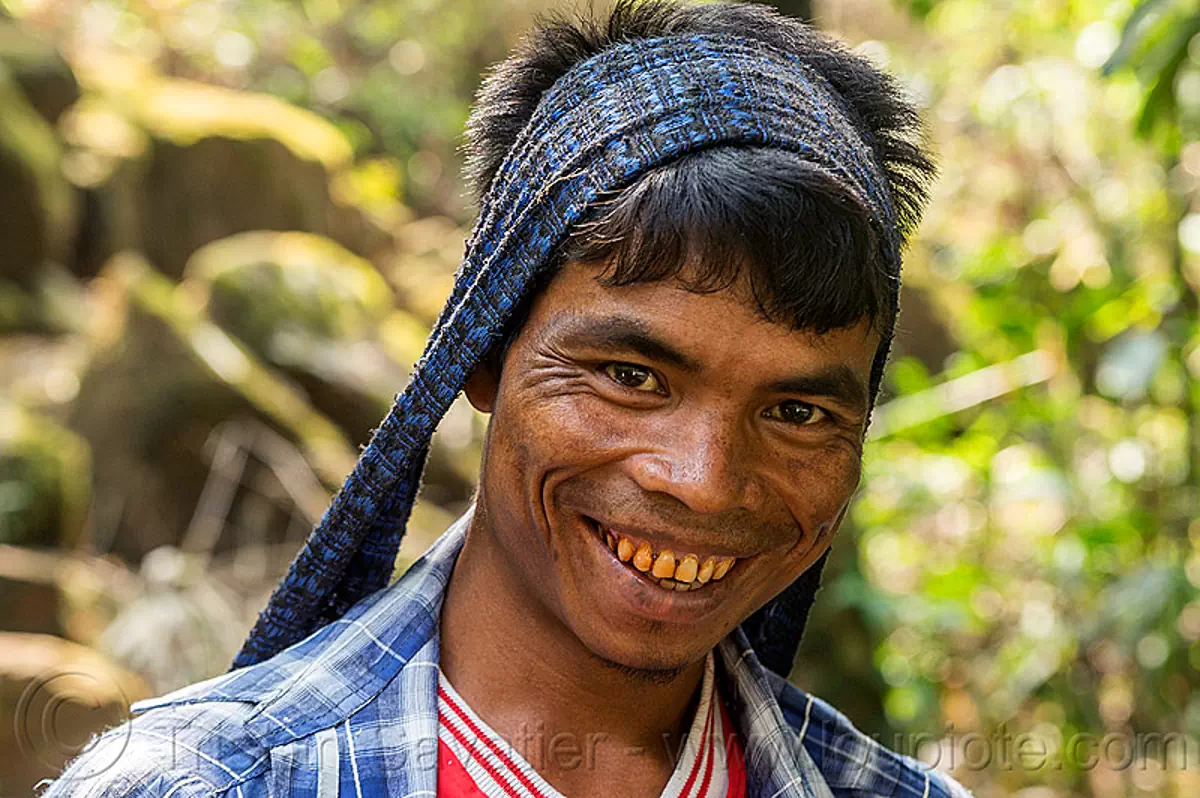 young khasi man, betel nut teeth, india