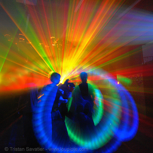 laser show, moving lights and shadows in warehouse underground rave party