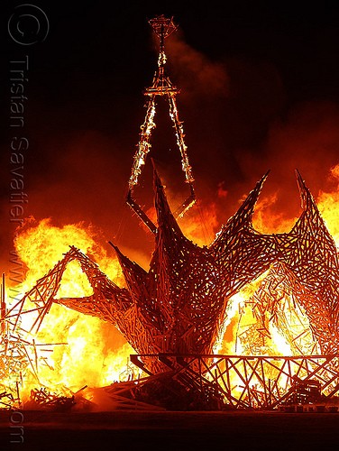 crowd around the burning man