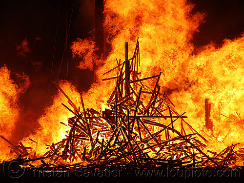 crowd around the burning man