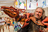 burning man, dragon puppet, little girl